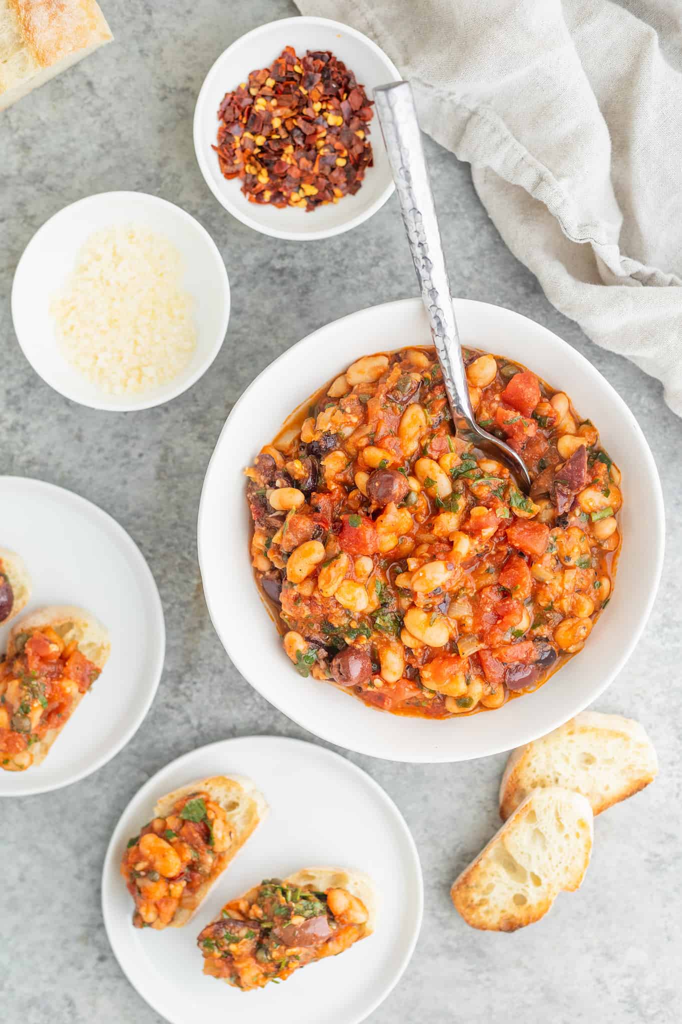 Puttanesca Beans with Garlic Bread - Delish Knowledge