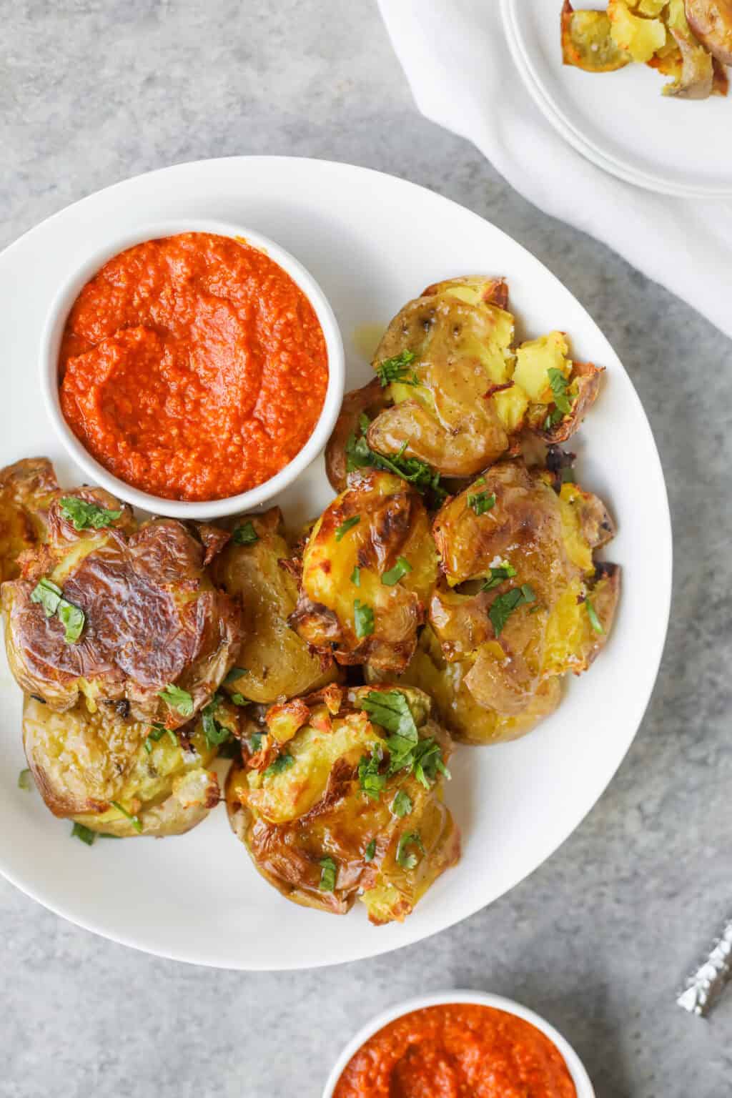 Smashed Potatoes with Romesco Sauce - Delish Knowledge