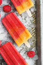 Sunset Orange Raspberry Popsicles - Delish Knowledge