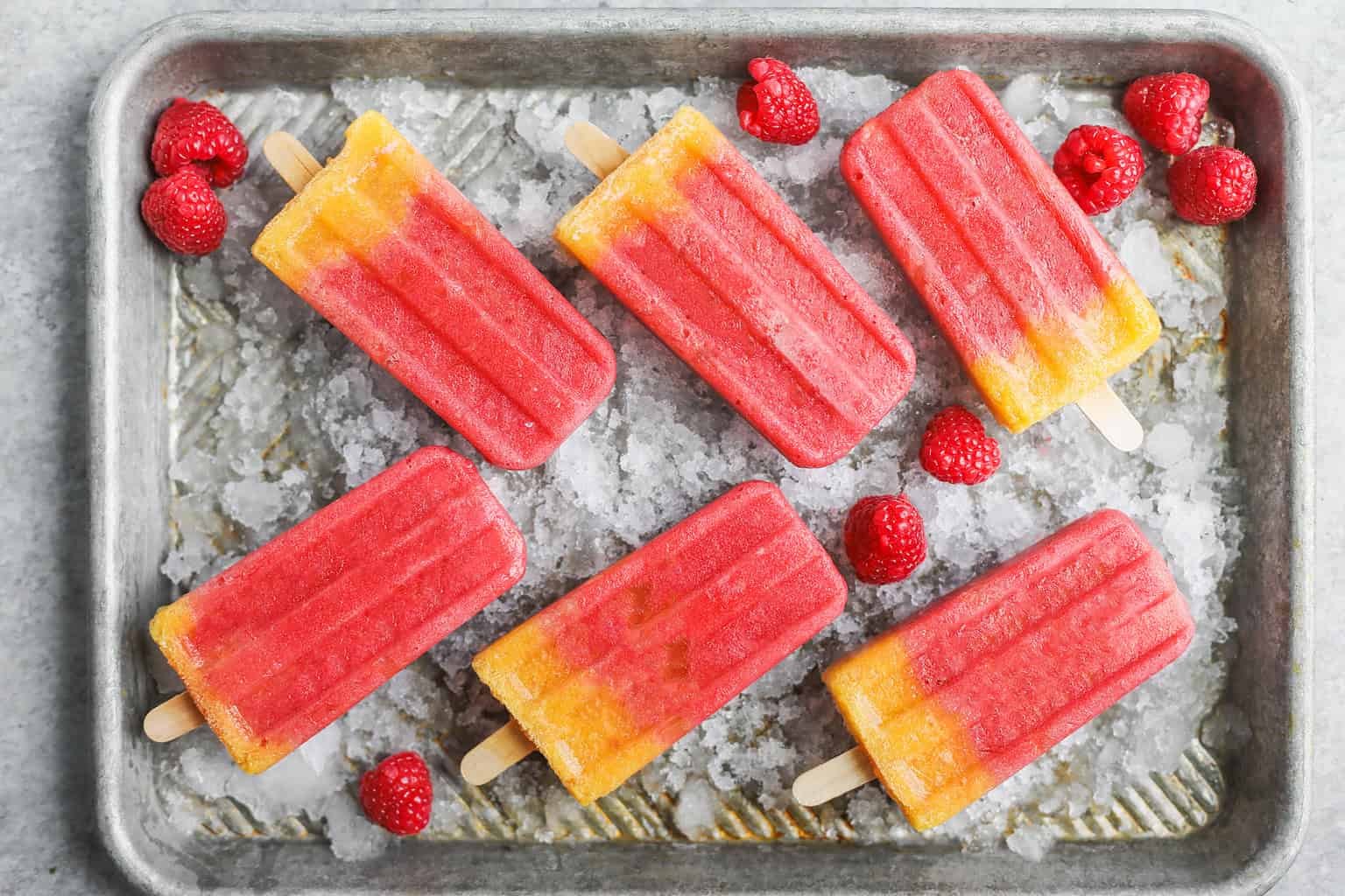 Sunset Orange Raspberry Popsicles - Delish Knowledge