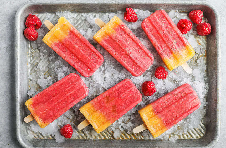 Sunset Orange Raspberry Popsicles - Delish Knowledge