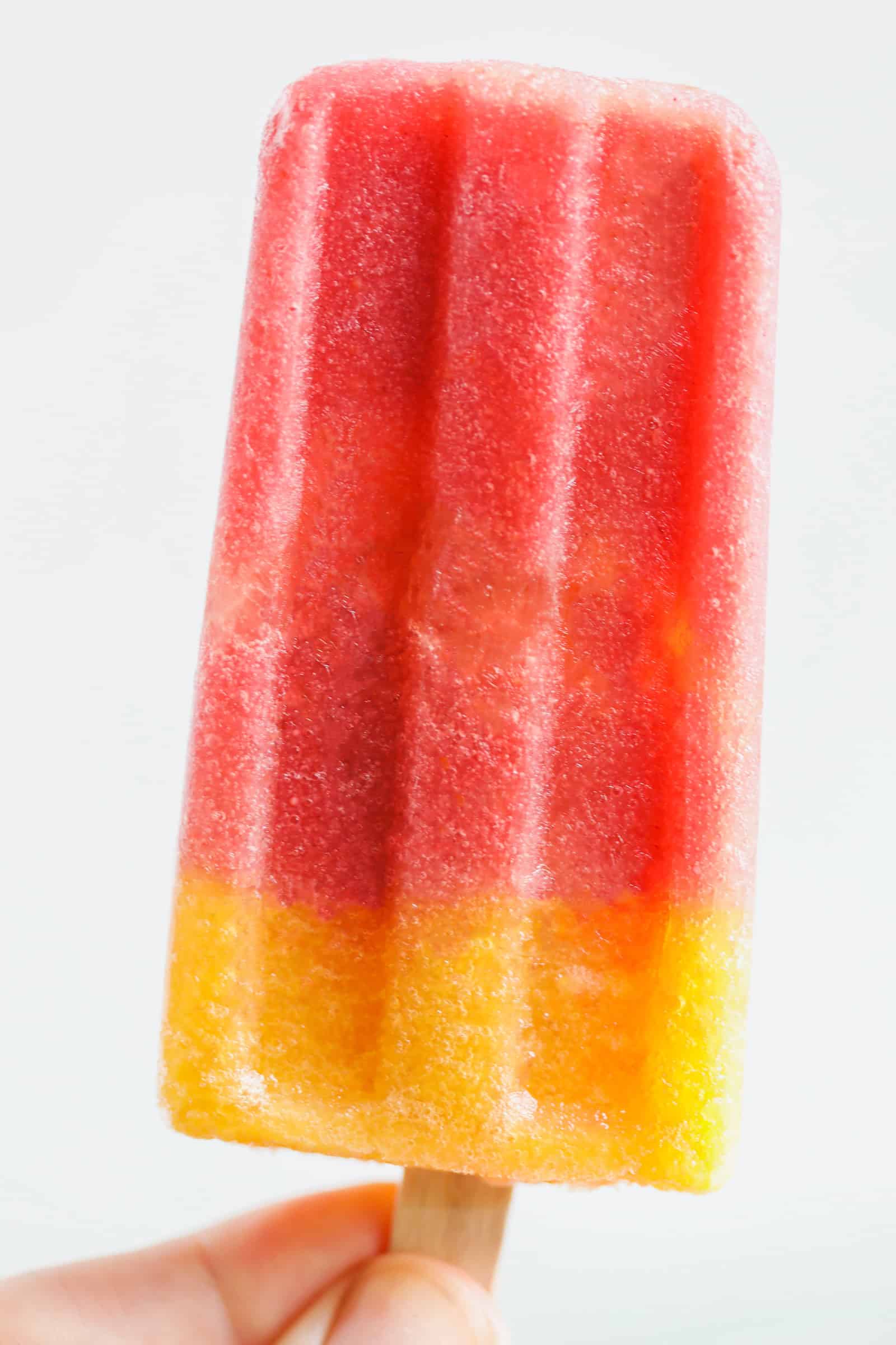 Sunset Orange Raspberry Popsicles - Delish Knowledge